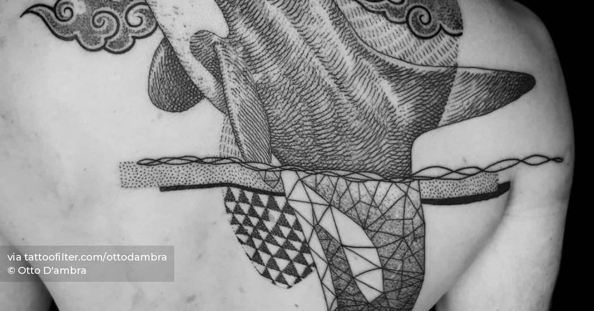 Whale tattoo on the back.