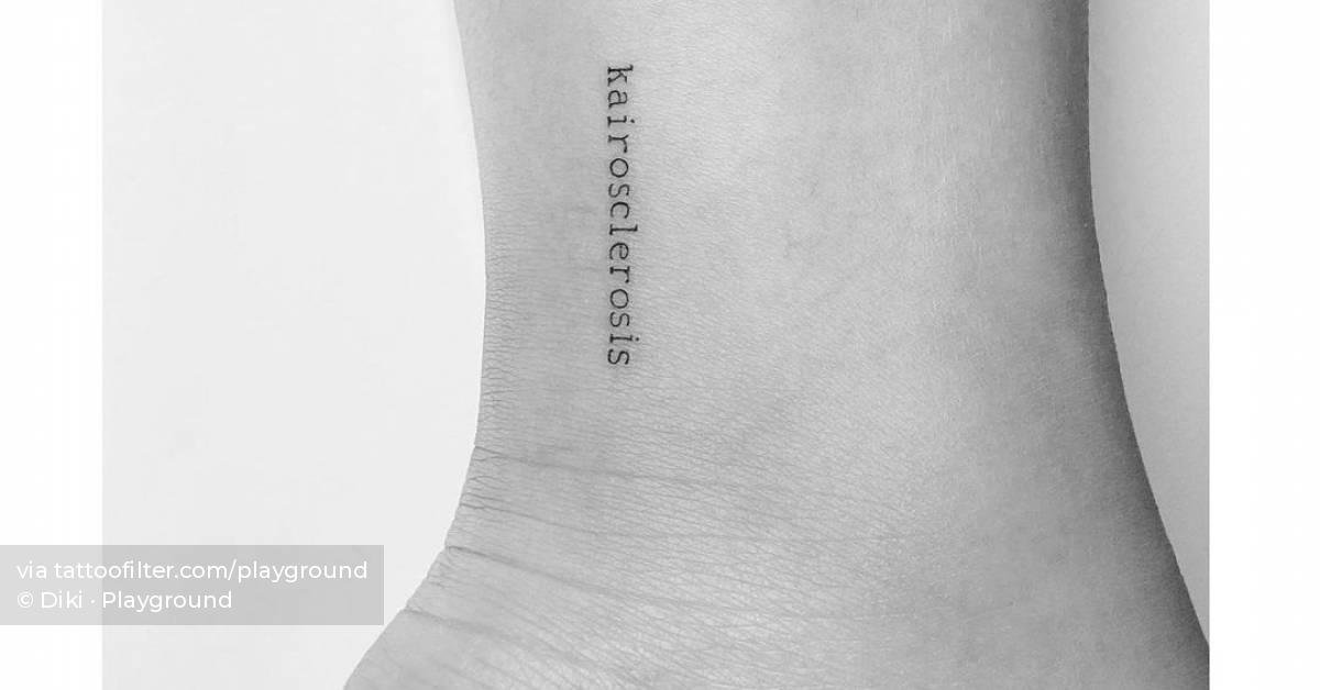 "Kairosclerosis" lettering tattoo on the ankle.