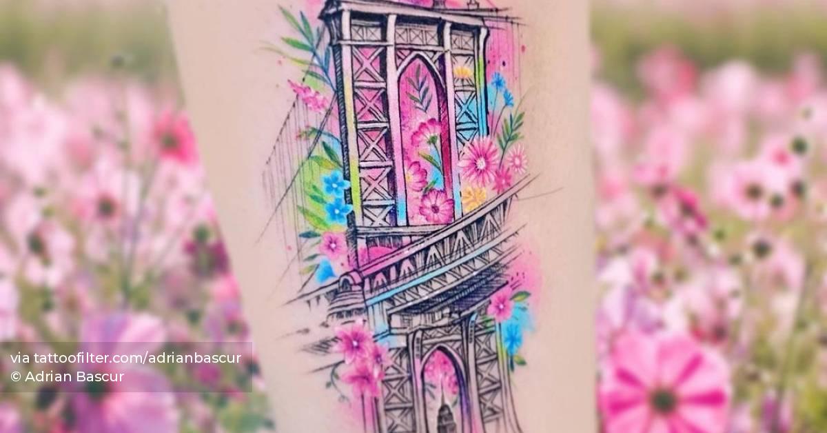 Manhattan Bridge tattoo on the inner forearm.
