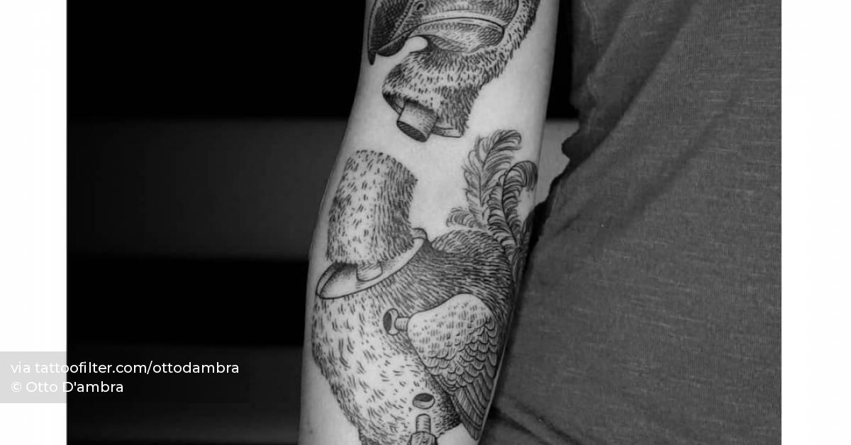 Surrealist dodo tattoo on the arm.