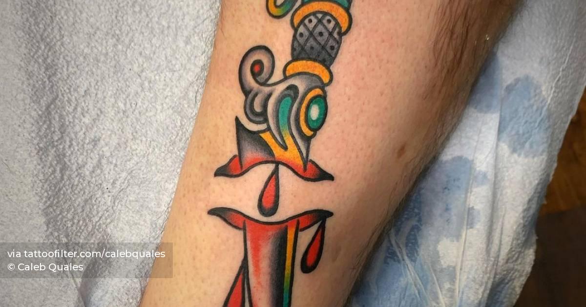 Traditional style dagger tattoo on the shin.