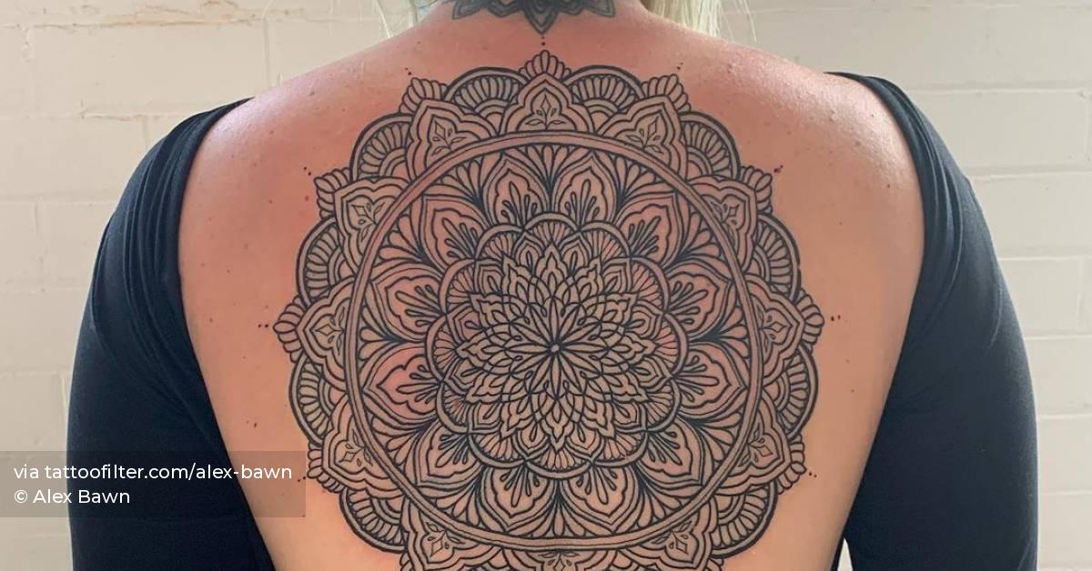 Huge mandala tattoo on the back.