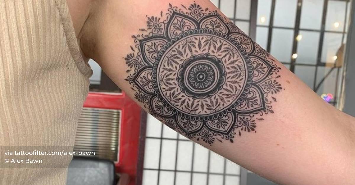 Mandala tattoo on the inner arm.