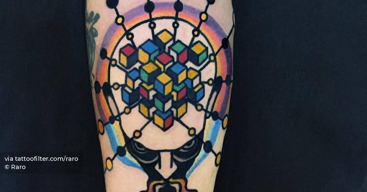 Traditional style Rubik's Cube and head tattoo