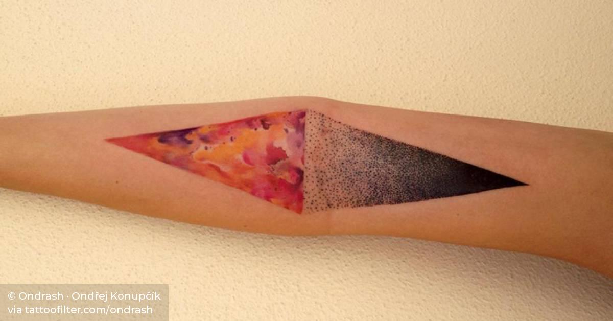 Abstract tattoo on the right arm.