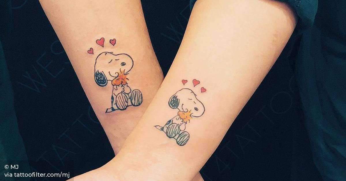 Sweet couple got a snoopy matching tattoo ..thanks