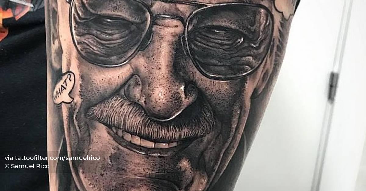 Black and grey Stan Lee portrait tattoo on the upper