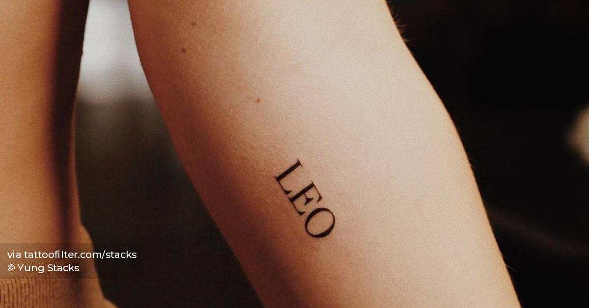 "Leo" lettering tattoo on the inner forearm.