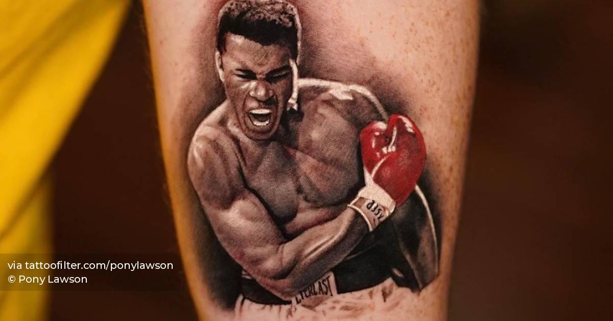 Micro-realistic Muhammad Ali tattoo on the inner