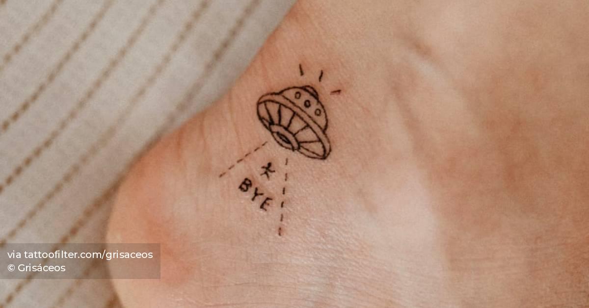 FIne line UFO tattoo on the ankle.