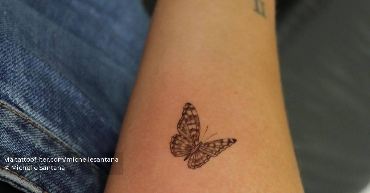 Micro-realistic butterfly tattoo on the inner forearm.