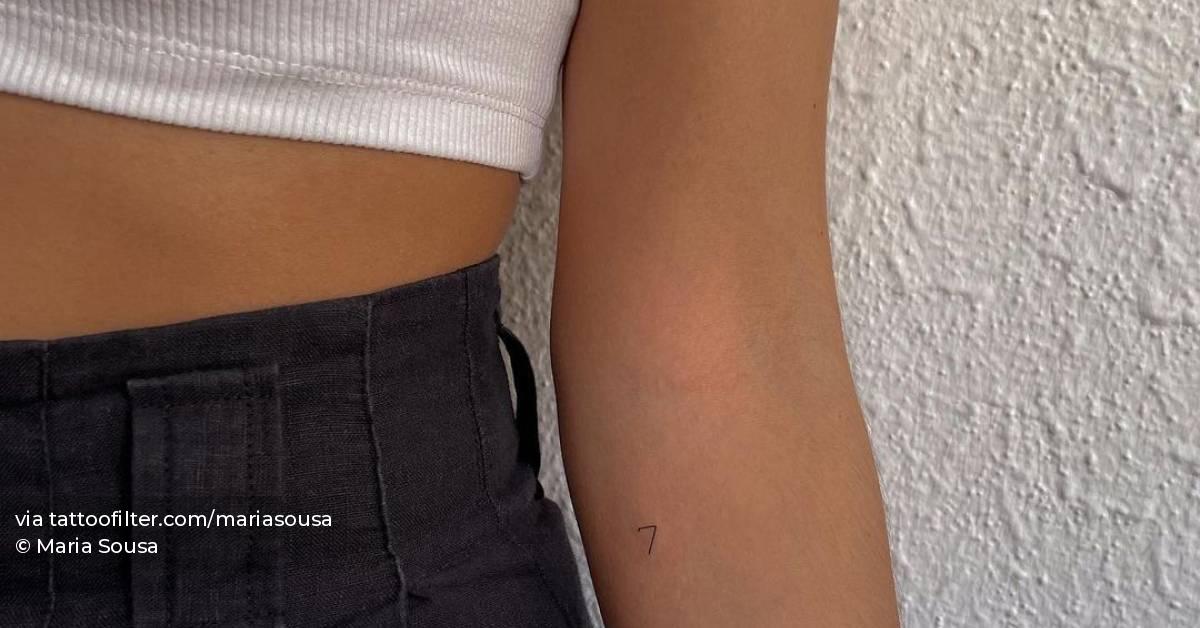 Minimalist number"7" lettering tattoo on the inner