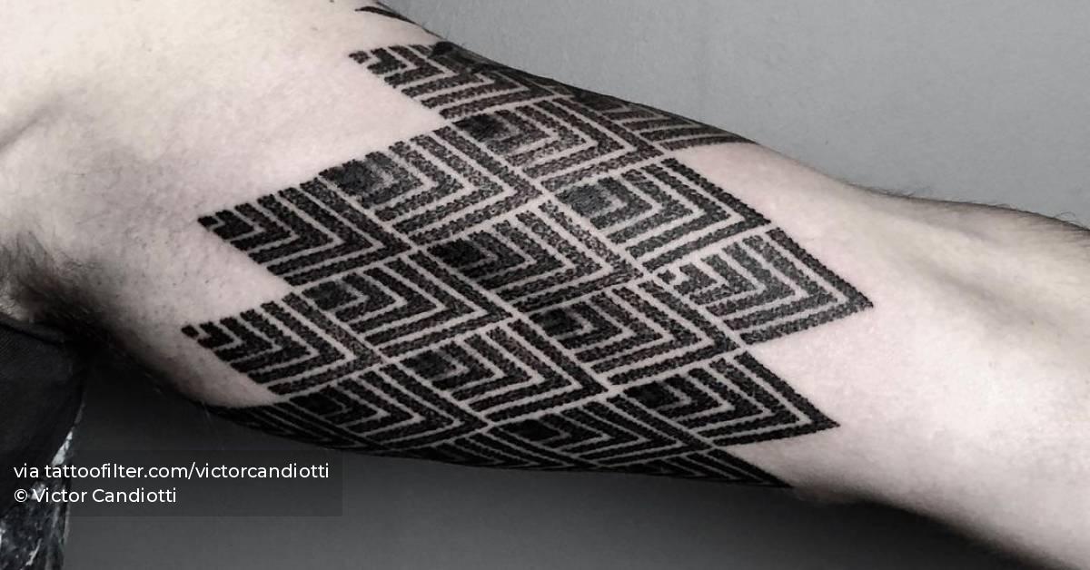 Dotwork geometric pattern tattoo on the inner arm.