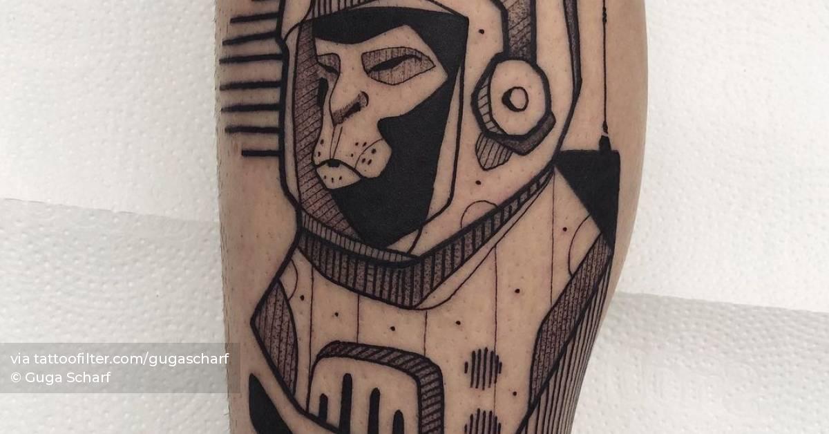 Blackwork monkey astronaut tattoo on the calf.
