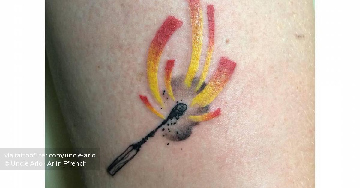 Abstract matchstick tattoo on the thigh.