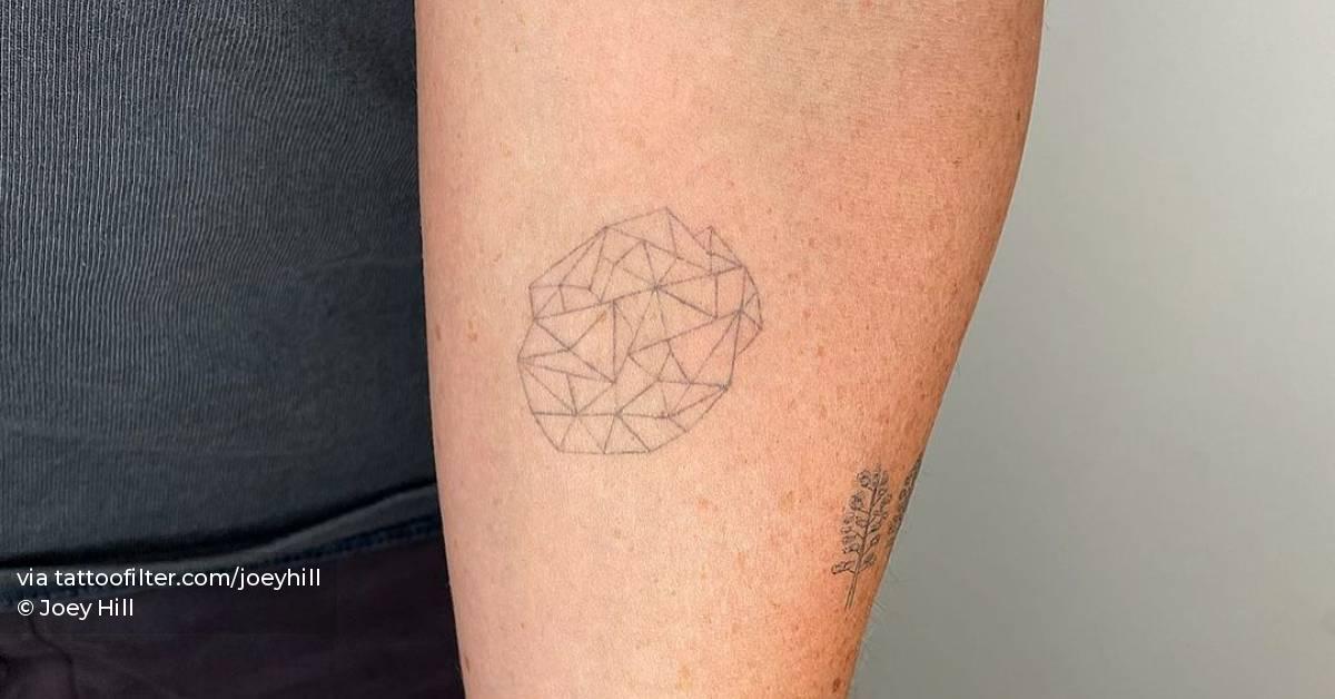 Fine line geometric shape tattoo on the inner forearm