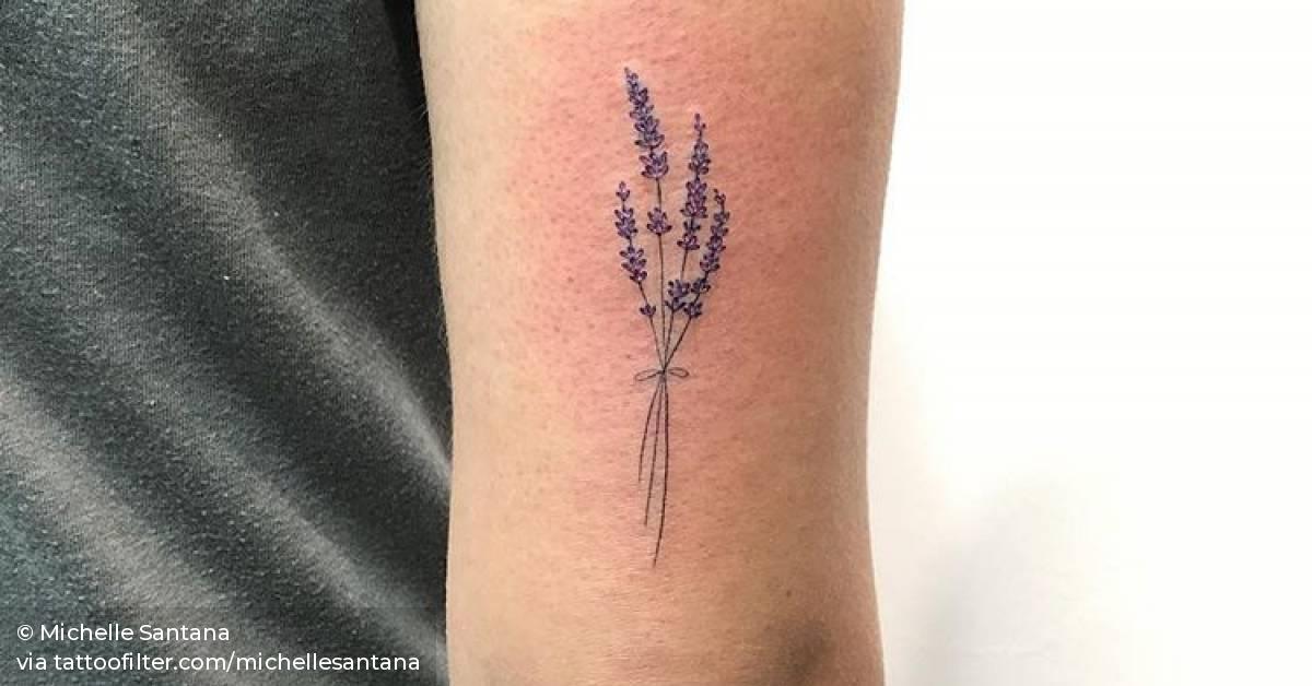 Lavender wreath tattoo on the back of the right arm.