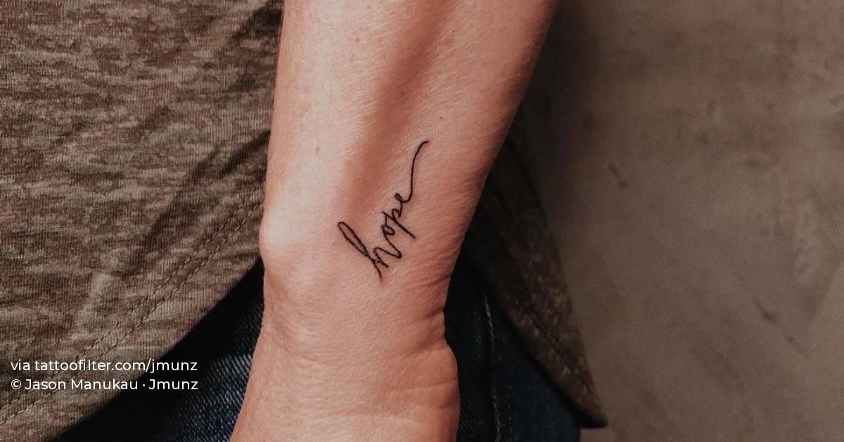 "Hope" lettering tattoo on the wrist.