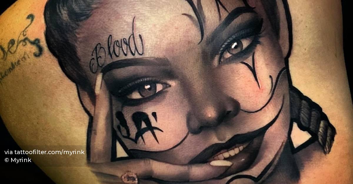 Black and grey Payasa portrait tattoo on the back.