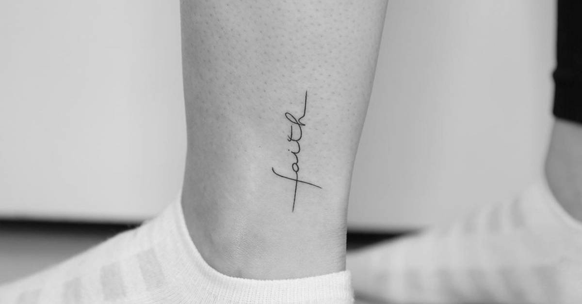 "Faith" lettering tattoo on the ankle.