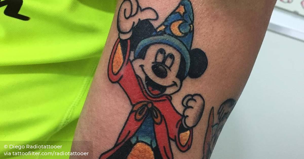 Mickey Mouse tattoo on the left bicep.