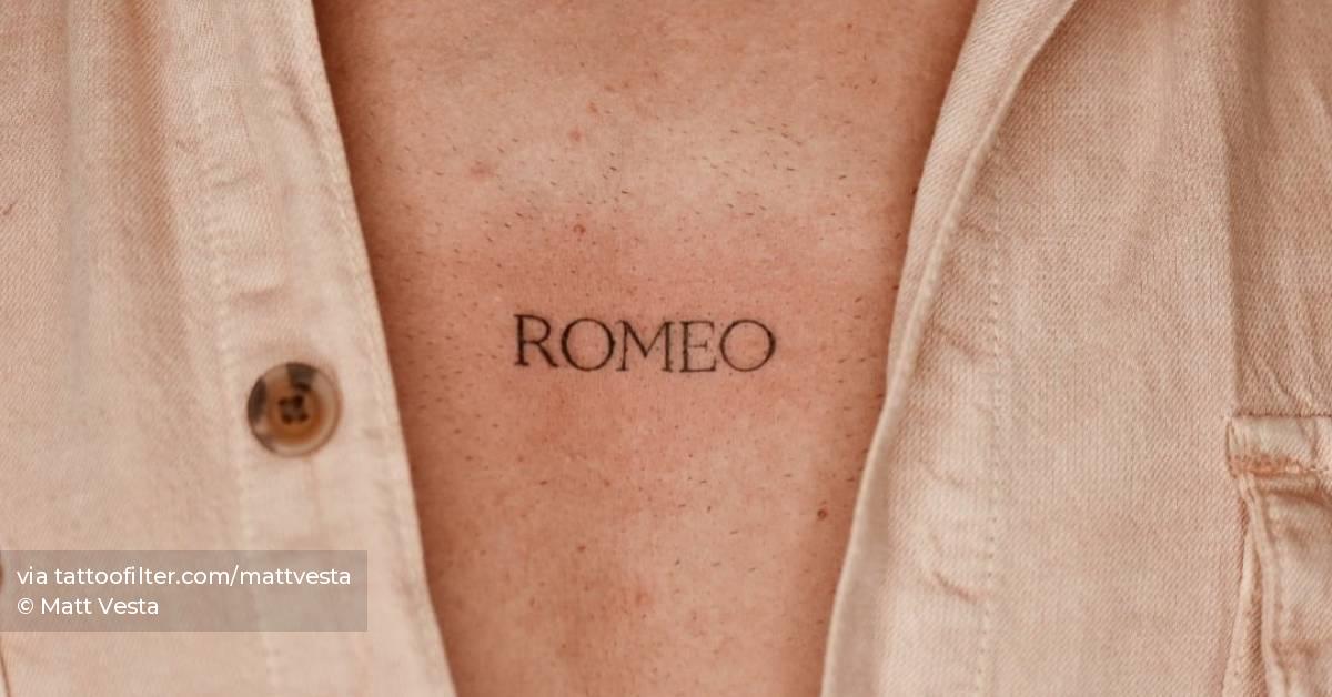 "Romeo" lettering tattoo on the chest.