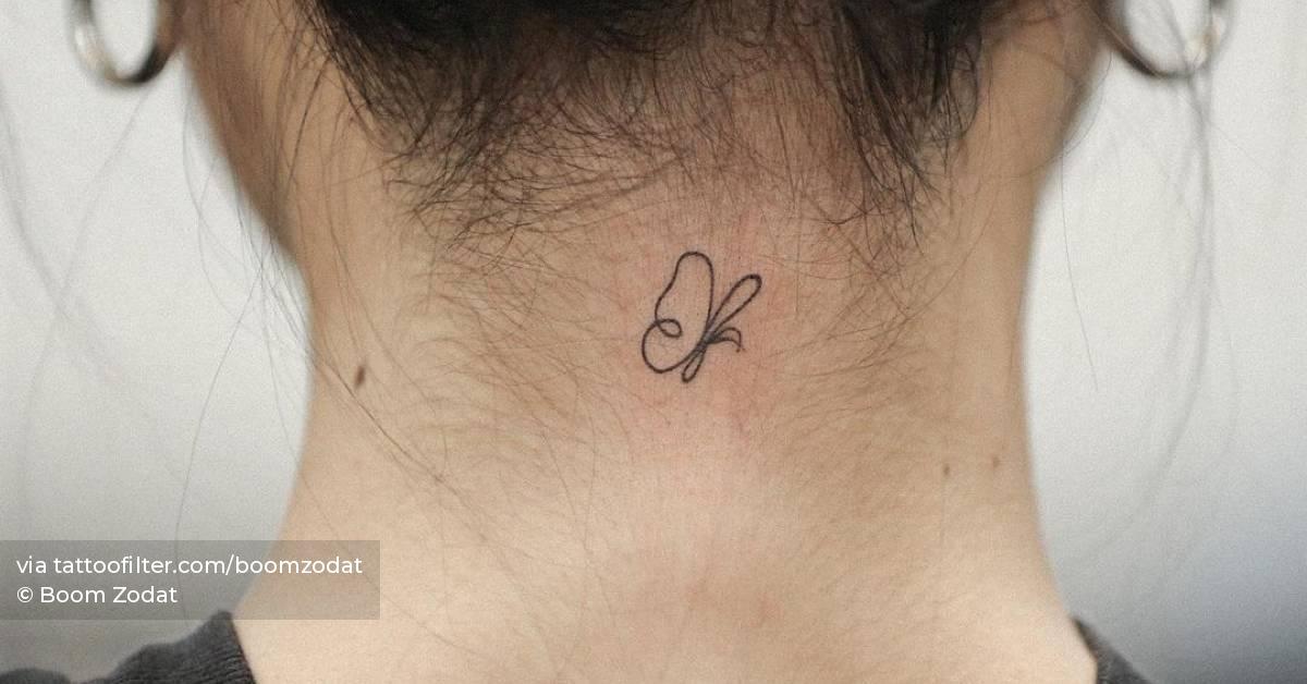 Minimalist one line butterfly tattoo on the back of the