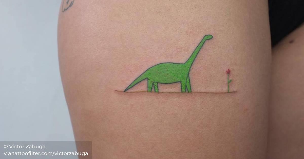Brontosaurus tattoo on the right thigh.