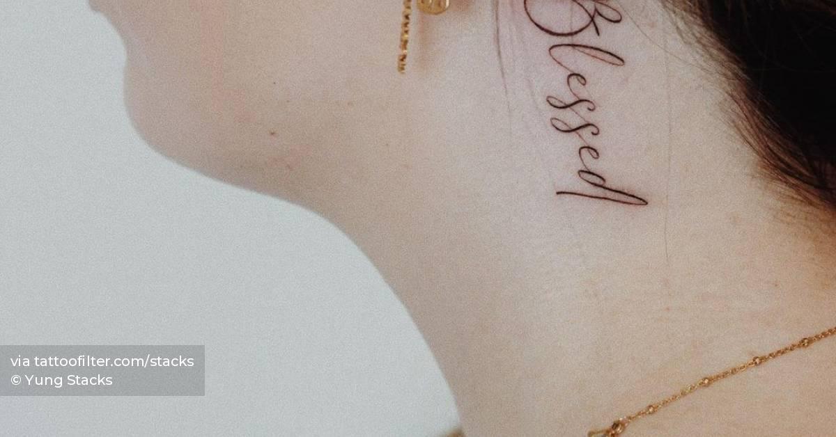 "Blessed" lettering tattoo on the neck.