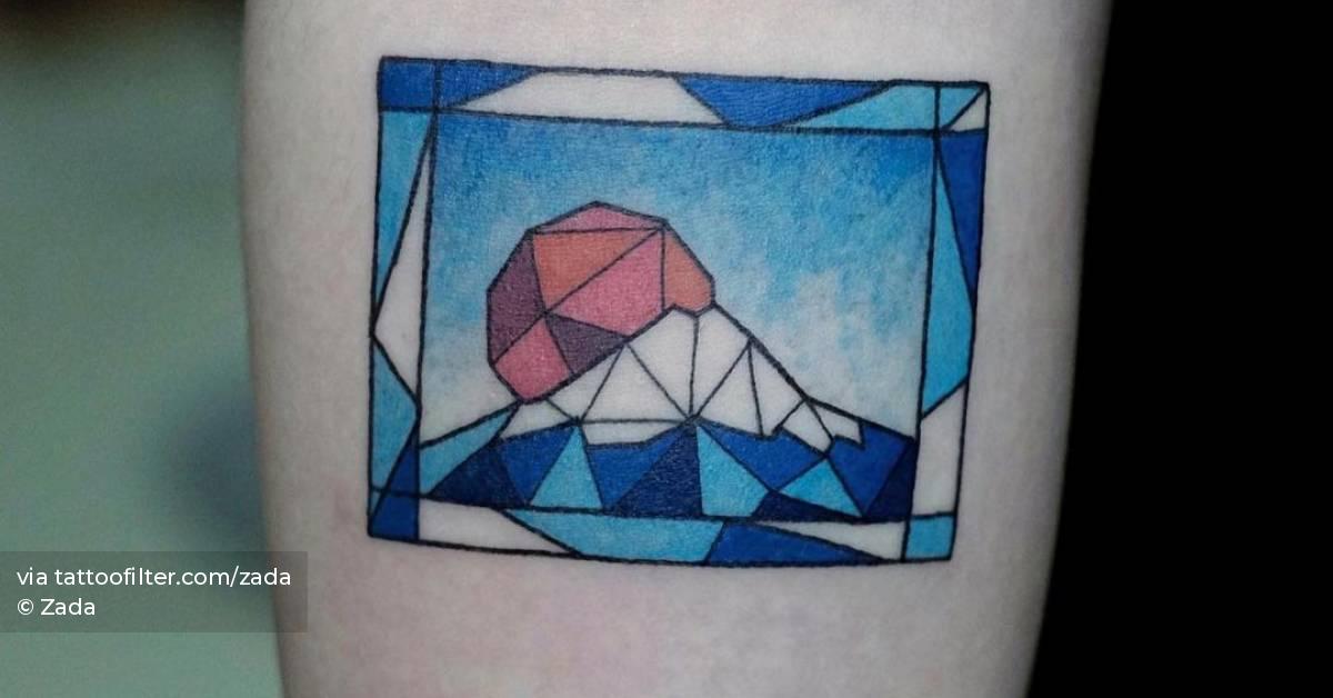 Stained glass Mount Fuji tattoo on the inner forearm.