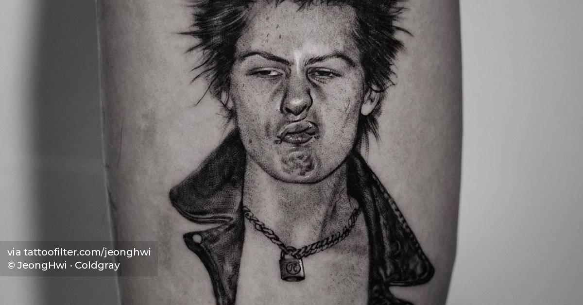 Micro-realistic Sid Vicious tattoo on the inner