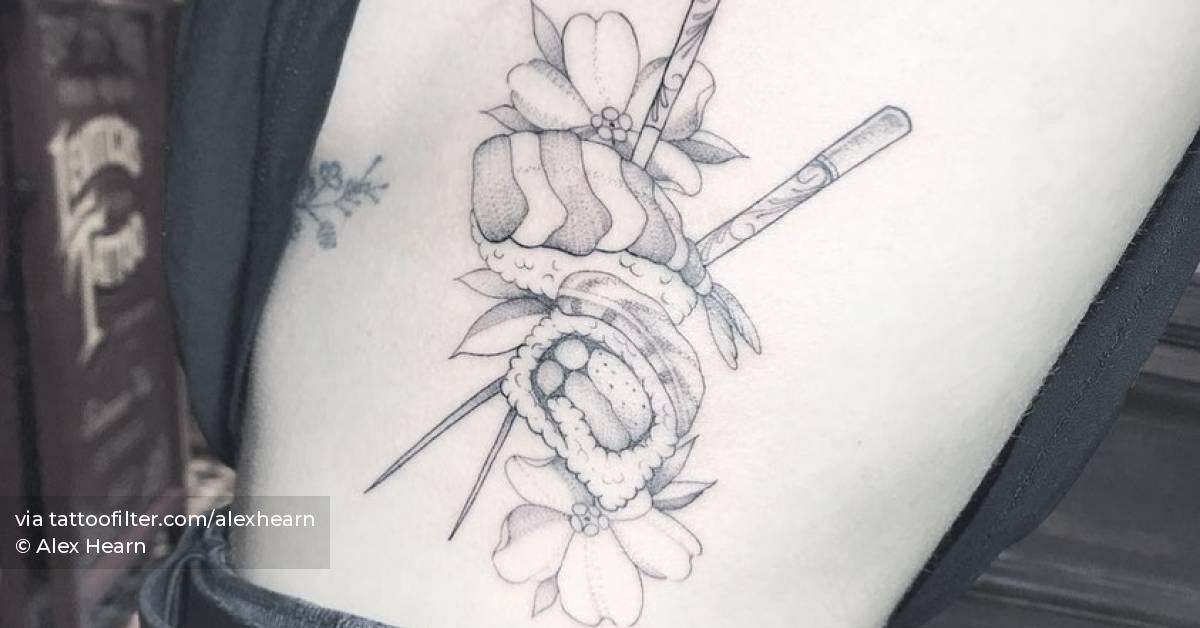 Fine line sushi tattoo on the rib.