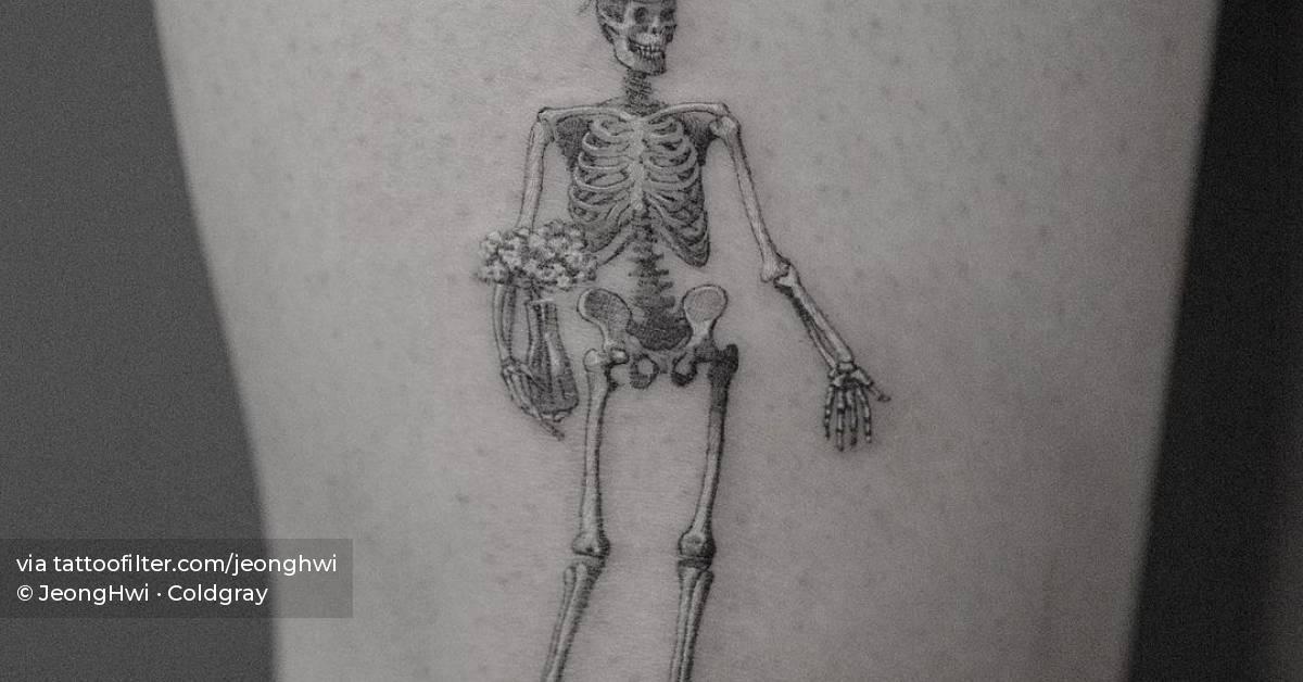 Micro-realistic skeleton tattoo on the thigh.
