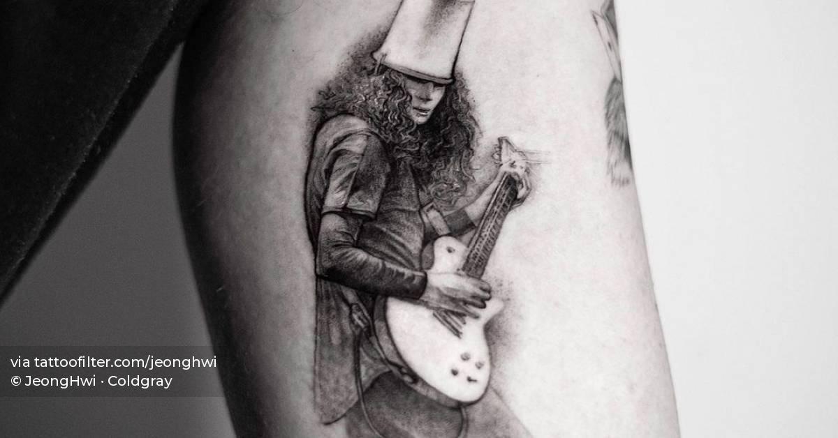 Micro-realistic Buckethead tattoo on the inner arm.