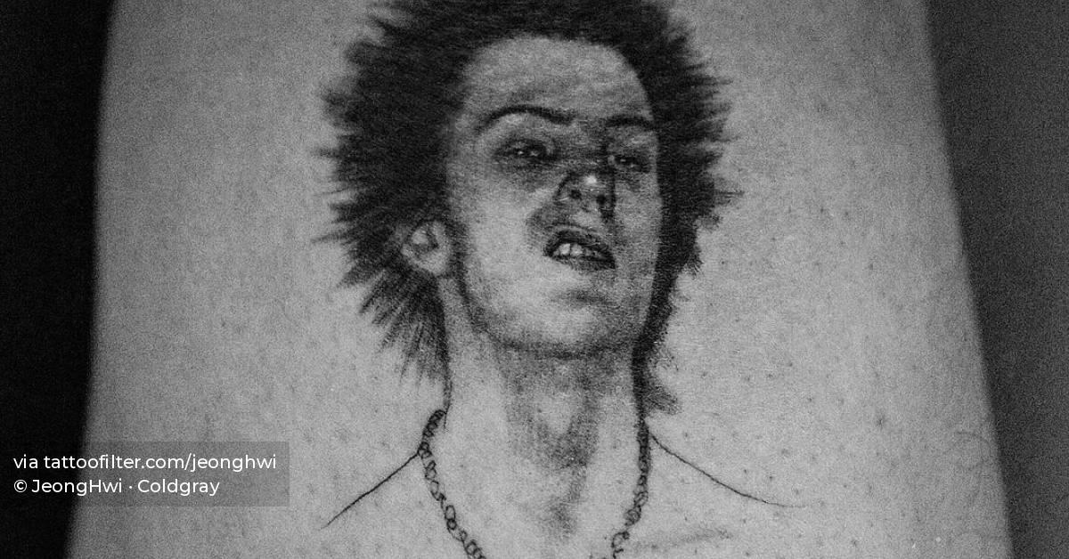 Micro-realistic Sid Vicious portrait tattoo on the