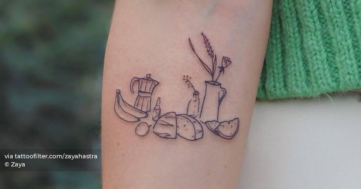 Minimalist still life tattoo on the inner forearm.