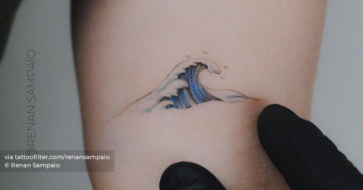 Wave tattoo on the inner arm.