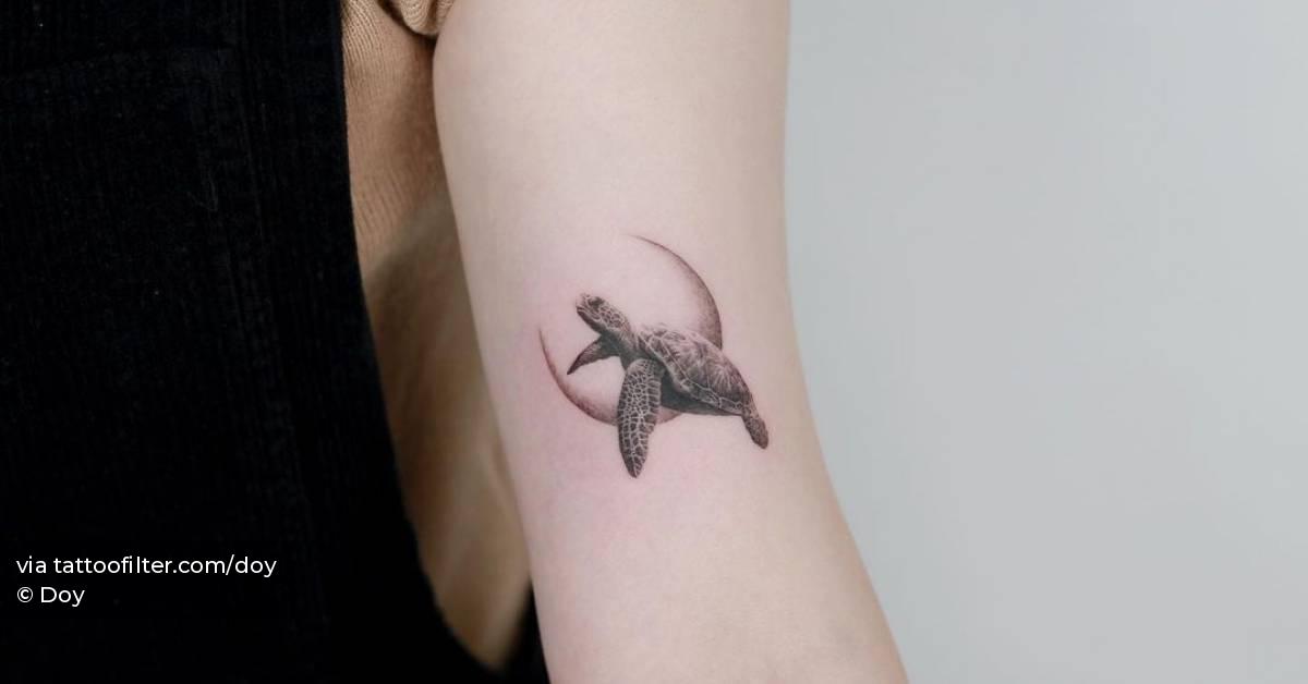Micro-realistic turtle tattoo on the bicep