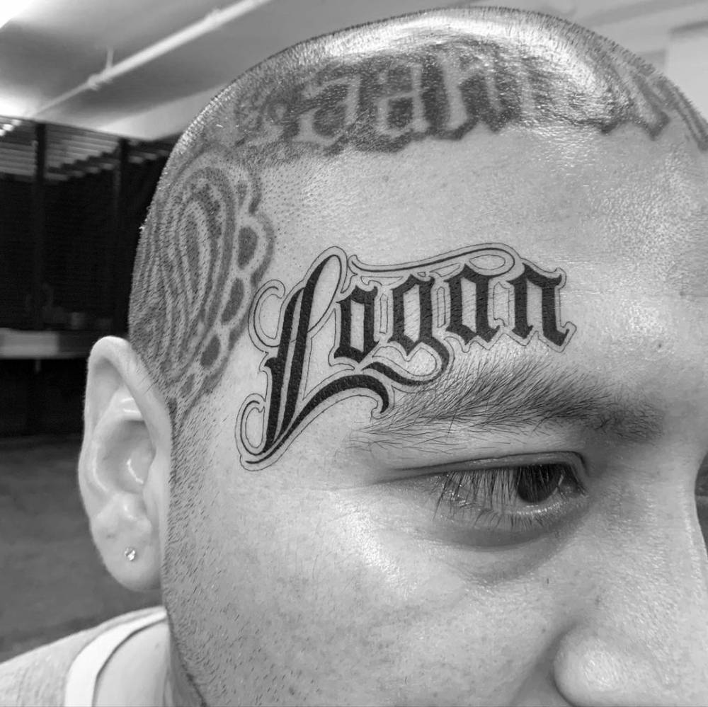 Logan Lettering Tattoo On The Face Logan Lettering Tattoo On The Face