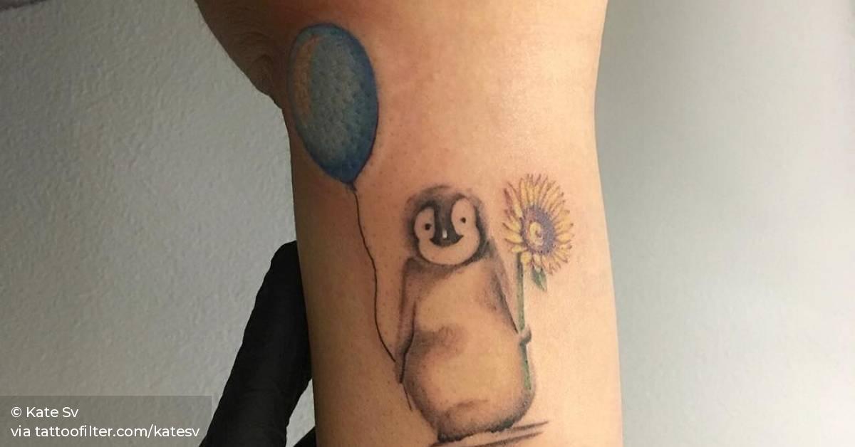 Penguin with sunflower