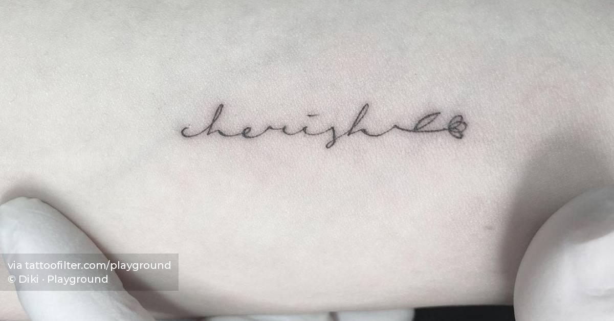 "Cherish" lettering tattoo on the inner forearm.