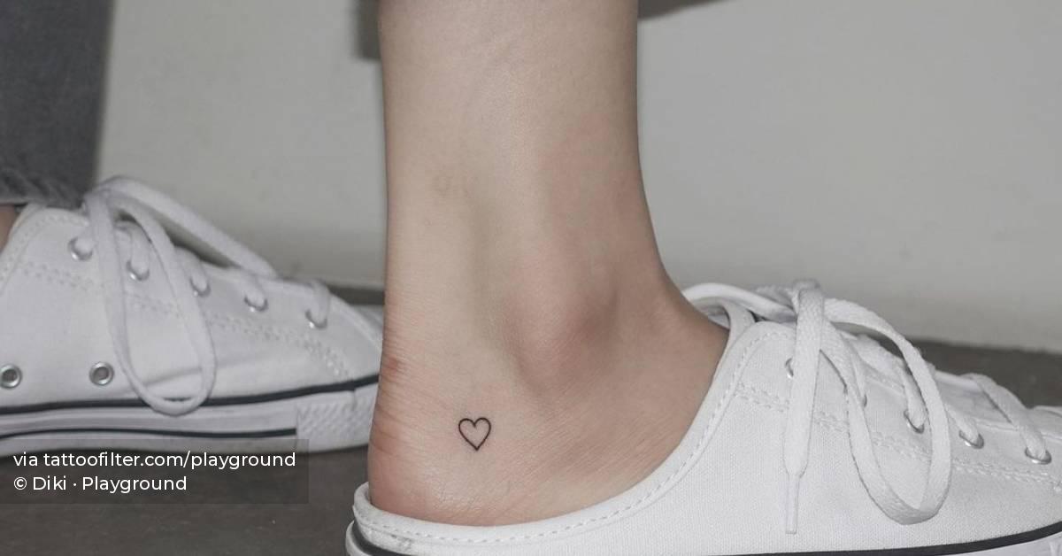 Minimalist heart tattoo on the ankle.