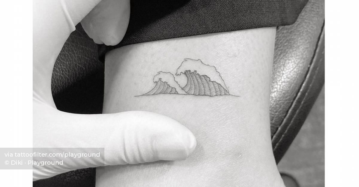 Fine line wave tattoo onb the ankle.