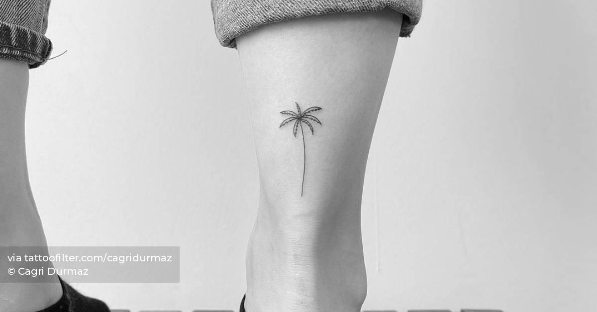 Fine line palm tree tattoo on the achilles.