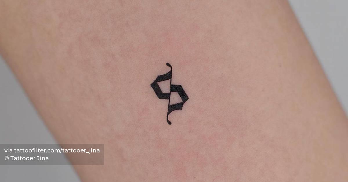 Letter "S" tattooed on the bicep