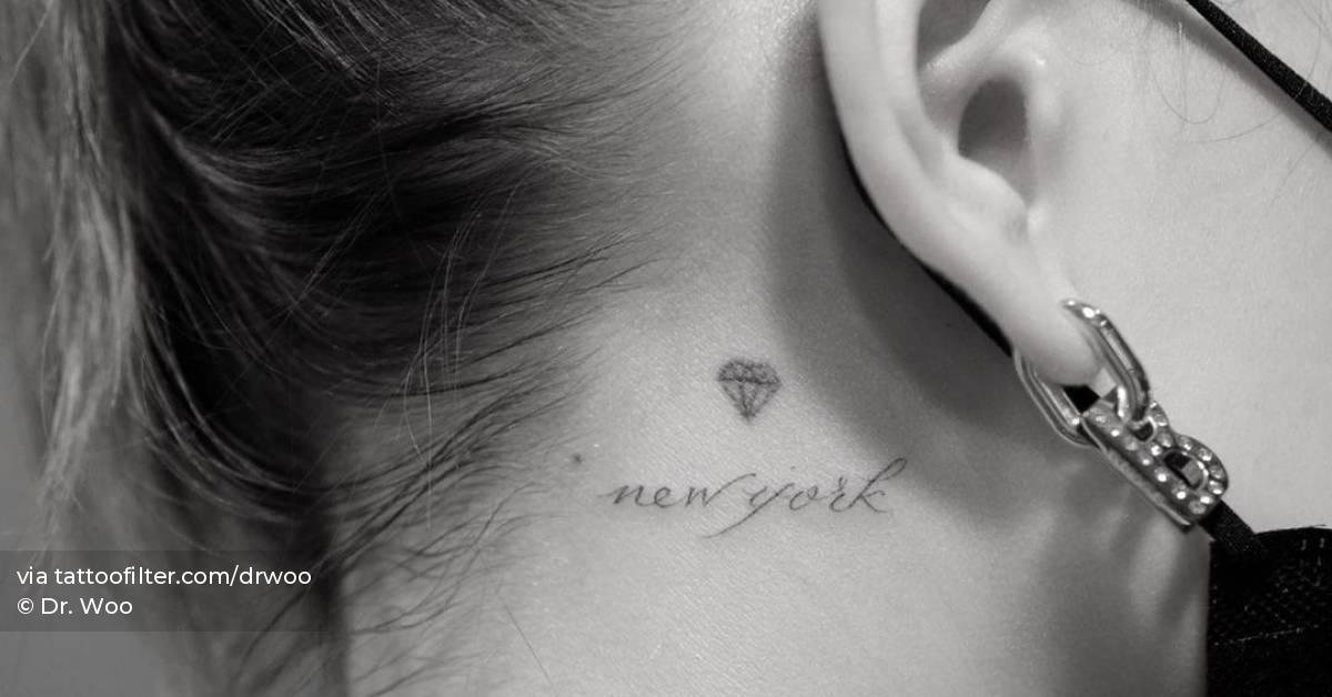 "New York" lettering tattoo on Hailey Bieber's neck.