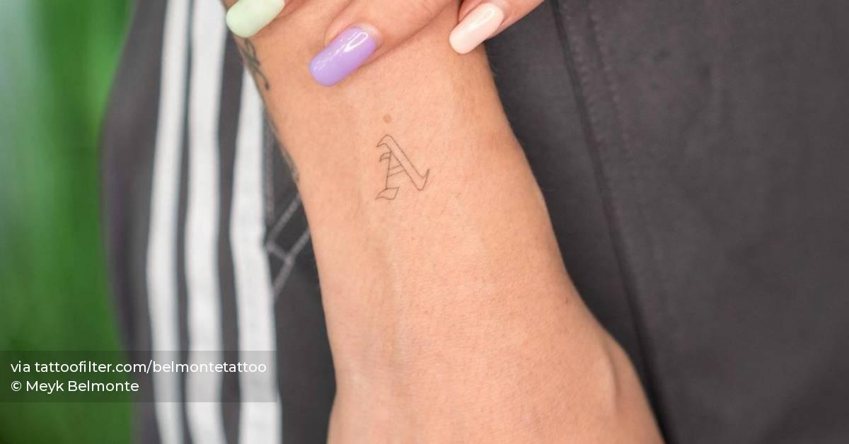 Letter "A" tattoo on the wrist
