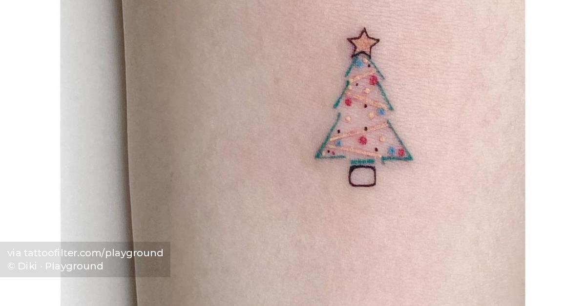 Christmas tree tattoo on the inner forearm.