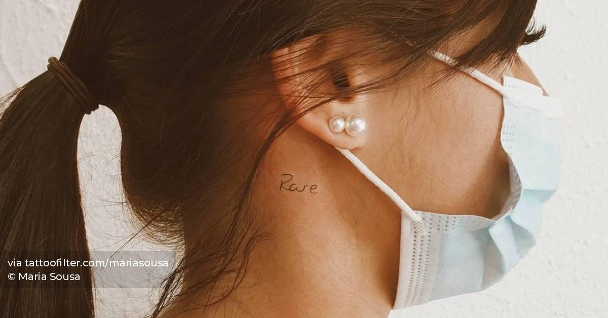 "Rare" lettering tattoo on the neck.