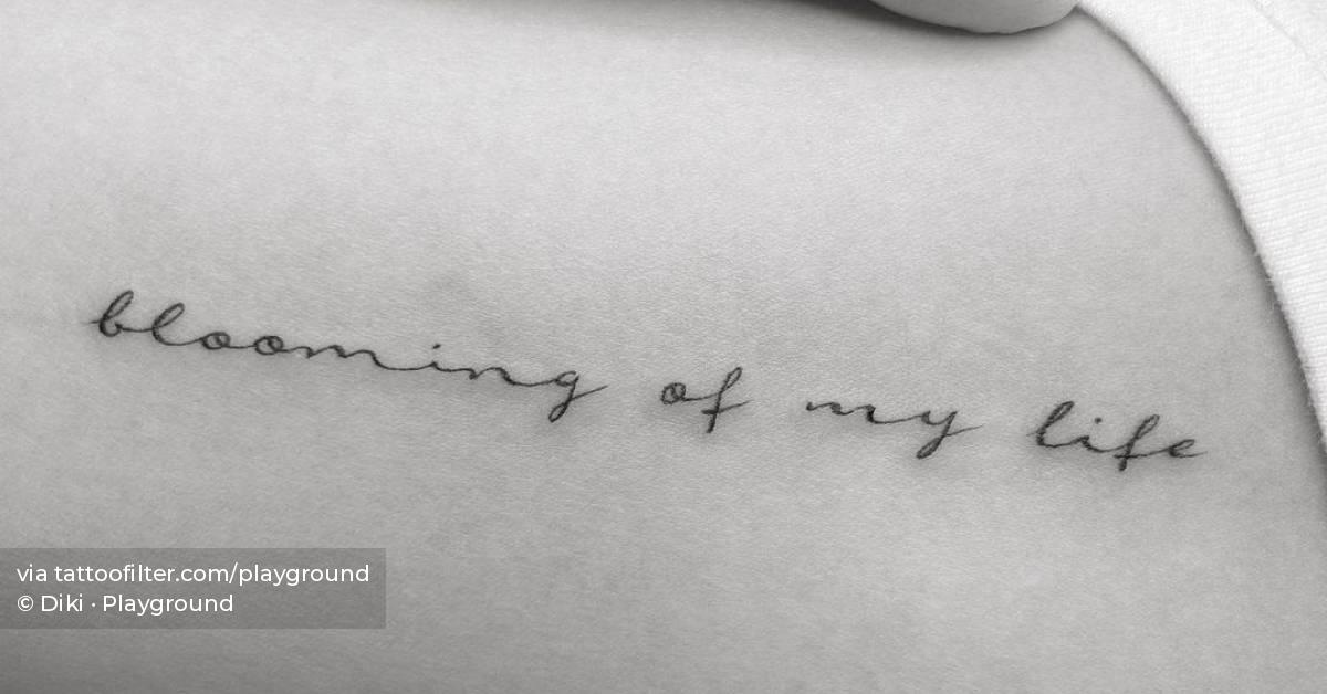 "Blooming of my life" lettering tattoo on the inner